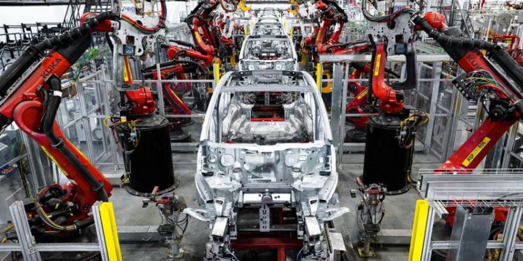 Tesla takes delivery of Kuka robots to produce the Cybertruck - EVMagz